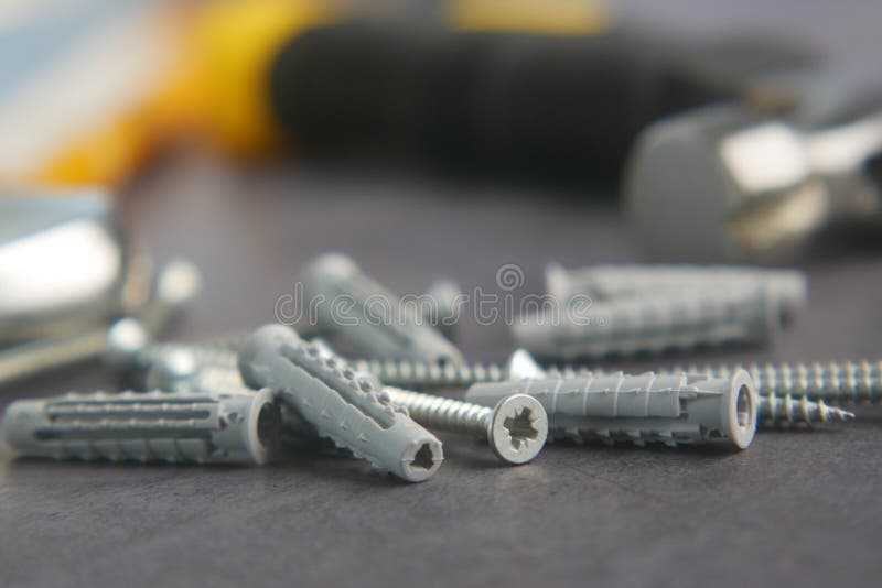 Various Screws and Anchors Arranged on a Work Surface Stock Photo ...