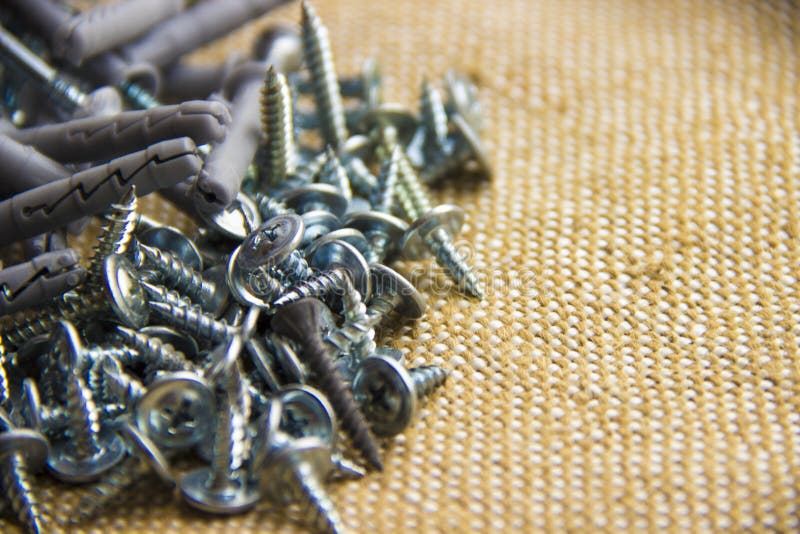 Various Screws with Dowels and Screws Lined on Burlap. Many Screws ...