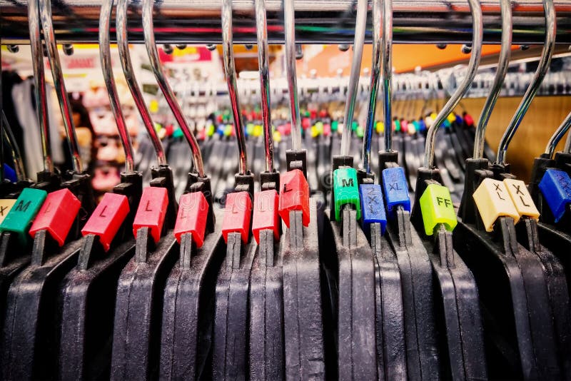 Various Size Tags for Clothes on a Rack. Editorial Stock Photo - Image ...