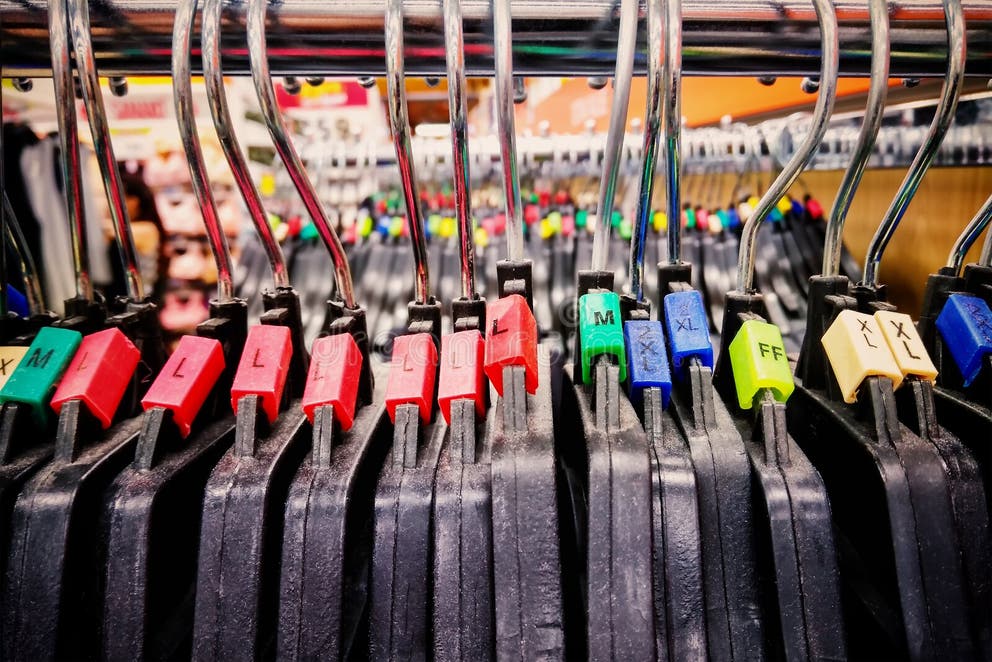 Various Size Tags for Clothes on a Rack. Editorial Stock Photo - Image ...