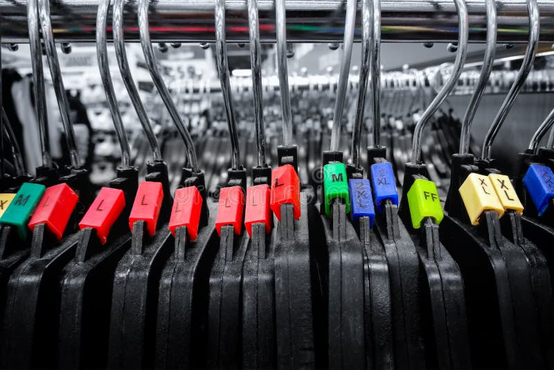 Various Size Tags for Clothes on a Rack. Stock Photo - Image of close ...