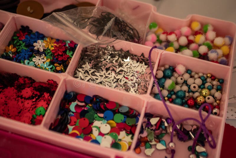 Various Small Items for Scrapbooking in a Pink Plastic Box Stock Photo ...