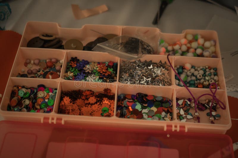 Various Small Items for Scrapbooking in a Pink Plastic Box Stock Image ...