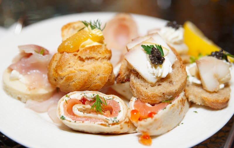 Various snacks on plate stock photo. Image of banquet - 18656324