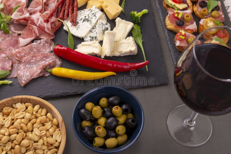 Various Snacks on Table with Wine Stock Image - Image of olive, eating ...