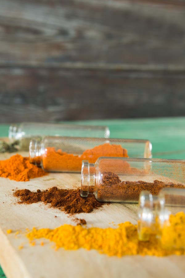 Various Spices Spilling Out of Bottles Stock Photo - Image of chili ...