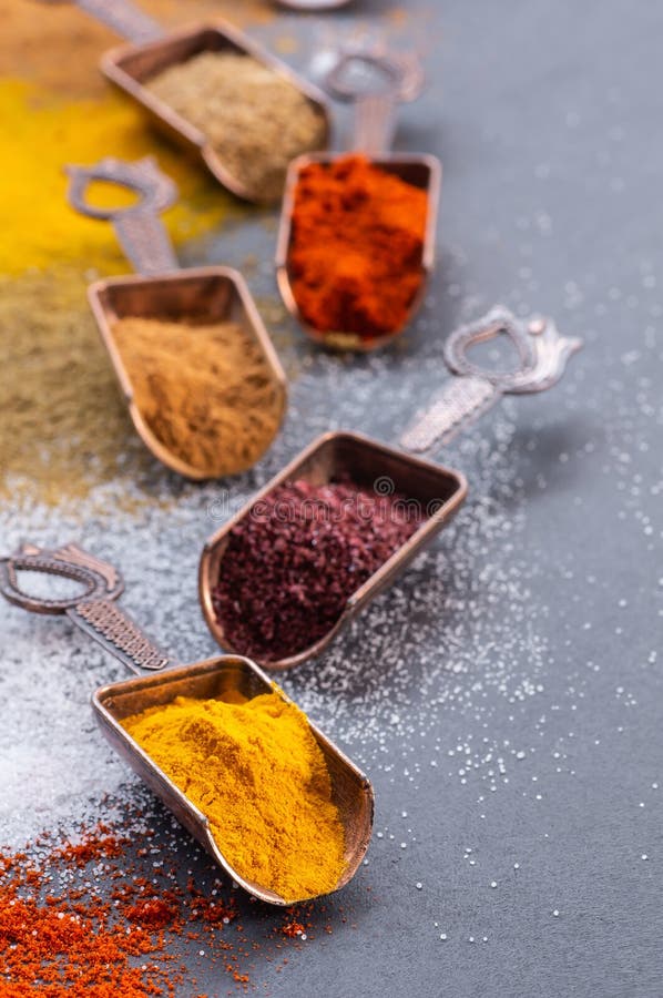 Various Spices in Spoon or Bowl on Dark Rustic Table Stock Image ...