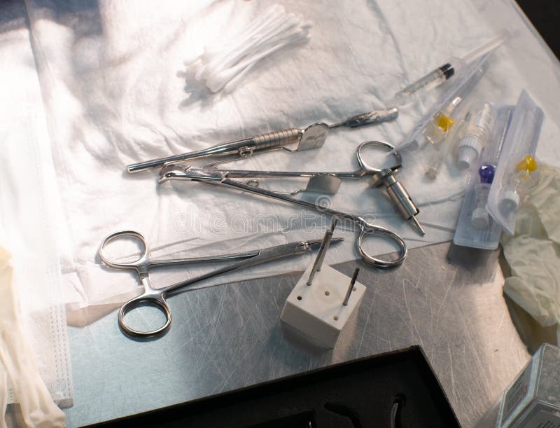 Various Surgical Instruments Lie on the Table. a Sterile Set of Working ...