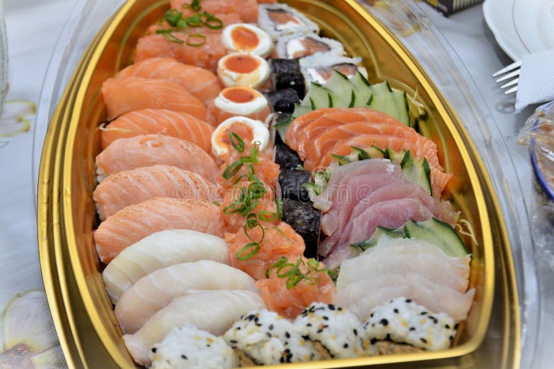 Various Sushi and Sashimi on the Table for a Party Stock Photo - Image ...