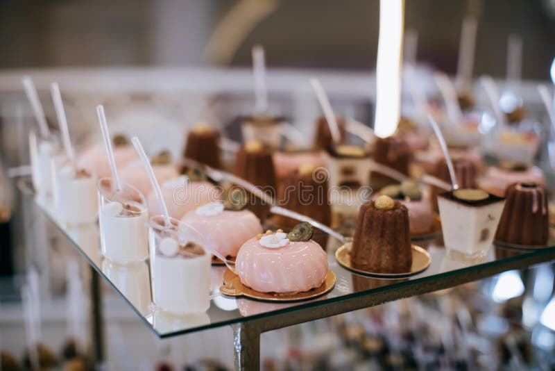 Various Sweets on the Table. Eclairs, Cakes, Candies Stock Image ...