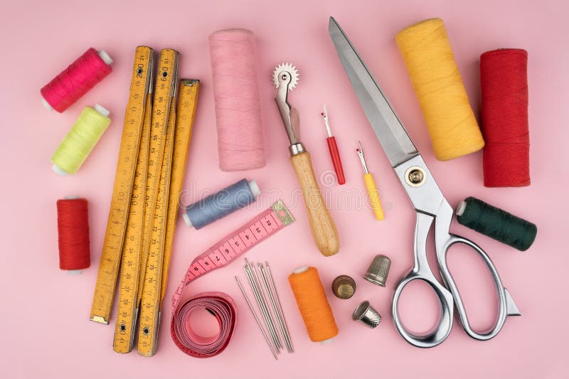 Various Tailor Accessories and Tools for Tailoring on a Pink Background ...