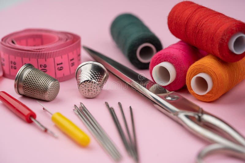 Various Tailor Accessories and Tools for Tailoring on a Pink Background ...
