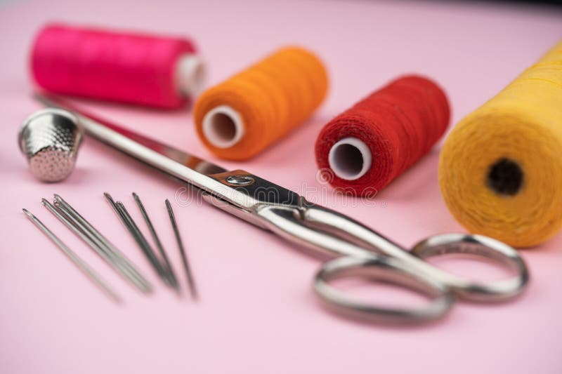Various Tailor Accessories and Tools for Tailoring on a Pink Background ...