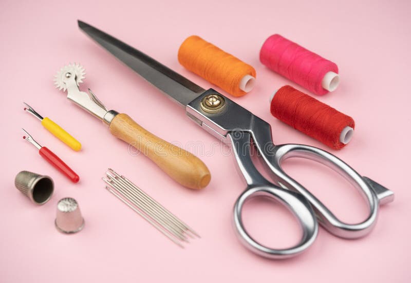 Various Tailor Accessories and Tools for Tailoring on a Pink Background ...