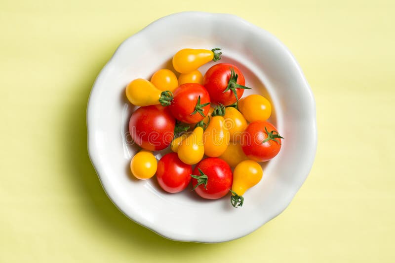 Various tomatoes on plate stock photo. Image of agriculture - 33815866