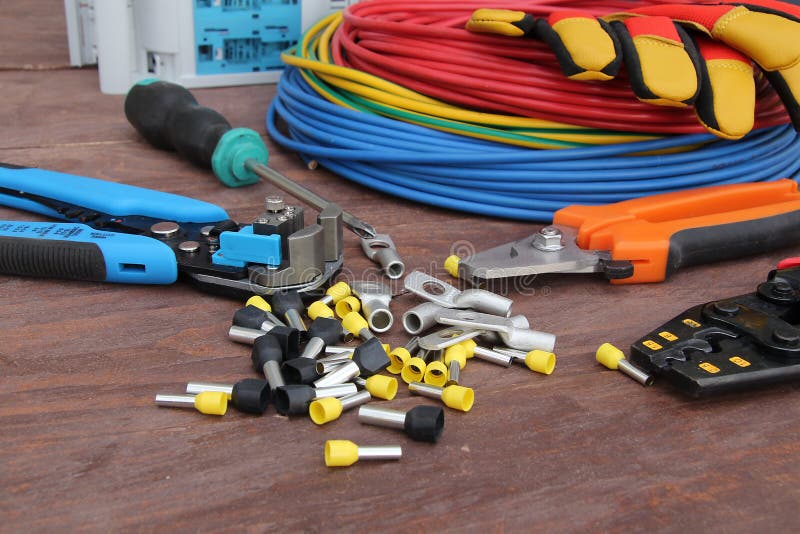 Electrician Tools with Red and Blue Wire Laid Out on a Wooden Surface ...