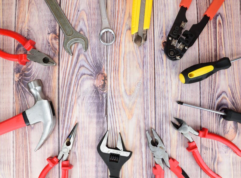 Various Tools Laid Out in a Circle on a Wooden Floor Stock Photo ...