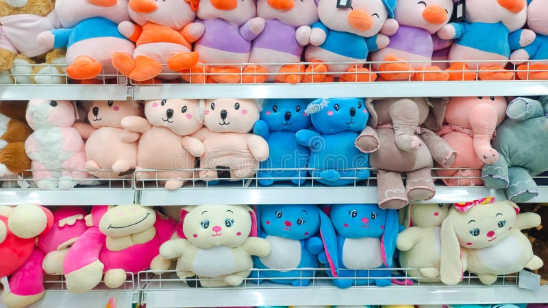 Various Types of Beautiful Dolls are Arranged on a Shelf Stock Photo ...