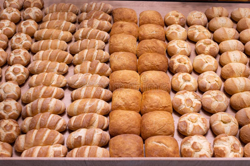 Various Types of Bread Buns Displayed Orderly on Top of a Wooden ...