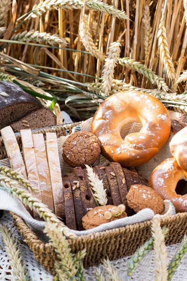 Various Types of Bread and Other Pastries in Wicker Tray on Lace ...