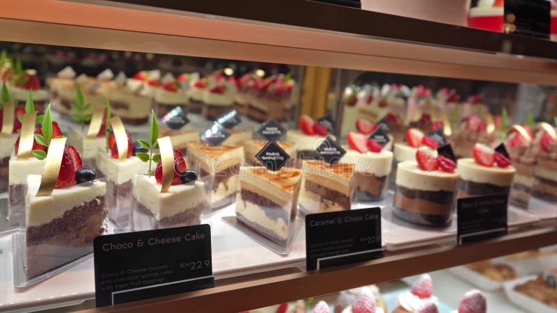 Various Types of Cakes Displayed on the Shelf and Selling in the Bakery ...