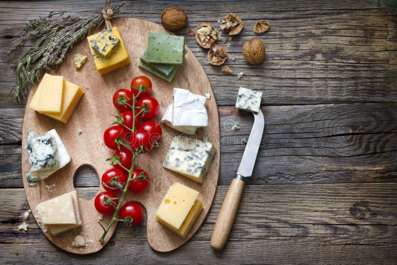 Various Types of Cheese on Abstract Vintage Paint Palette Stock Photo ...