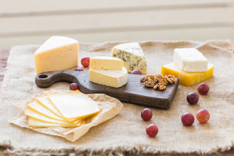 Various Types of Cheese, Blue Cheese and Brie with Grapes and Nuts ...
