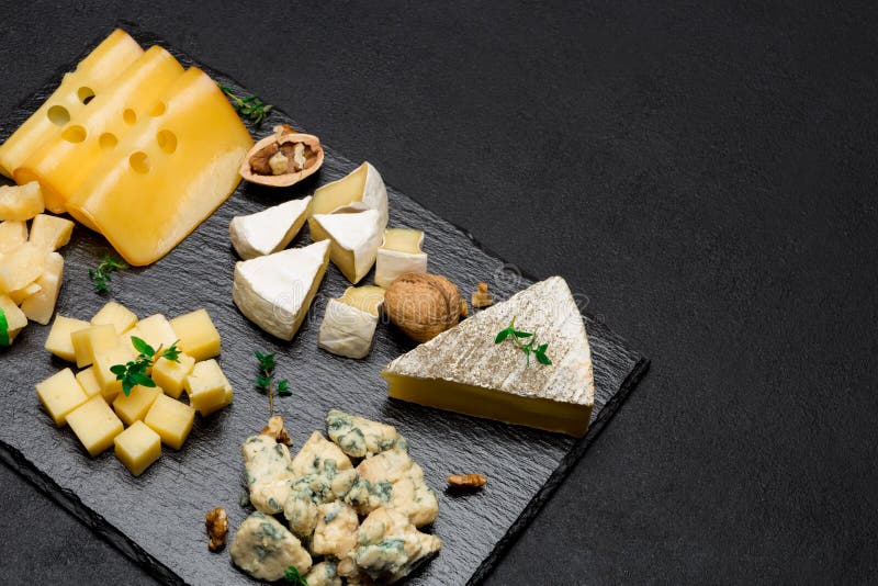 Various Types of Cheese - Brie, Camembert, Roquefort and Cheddar on ...