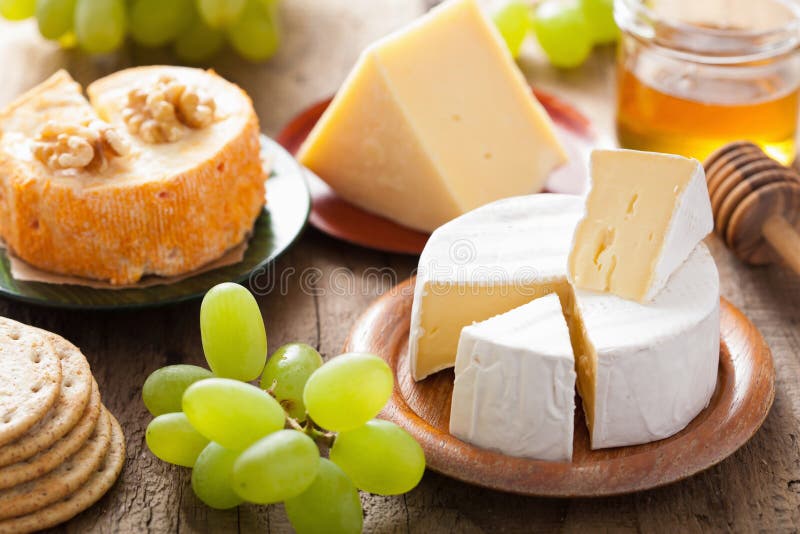 Various Types of Cheese with Grapes, Honey Nuts Stock Image - Image of ...