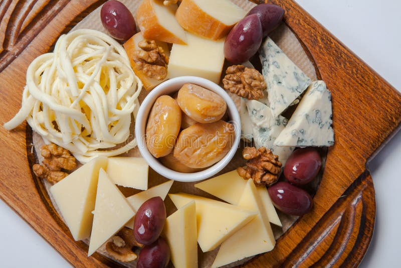 Various Types of Cheese on a Wooden Board Stock Image - Image of ...