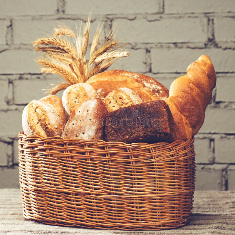 Various Types of Fresh Bread in a Basket. Bricks Background, Ton Stock ...