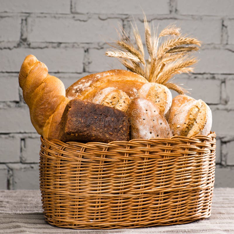 Various Types of Fresh Bread in a Basket Stock Photo - Image of board ...