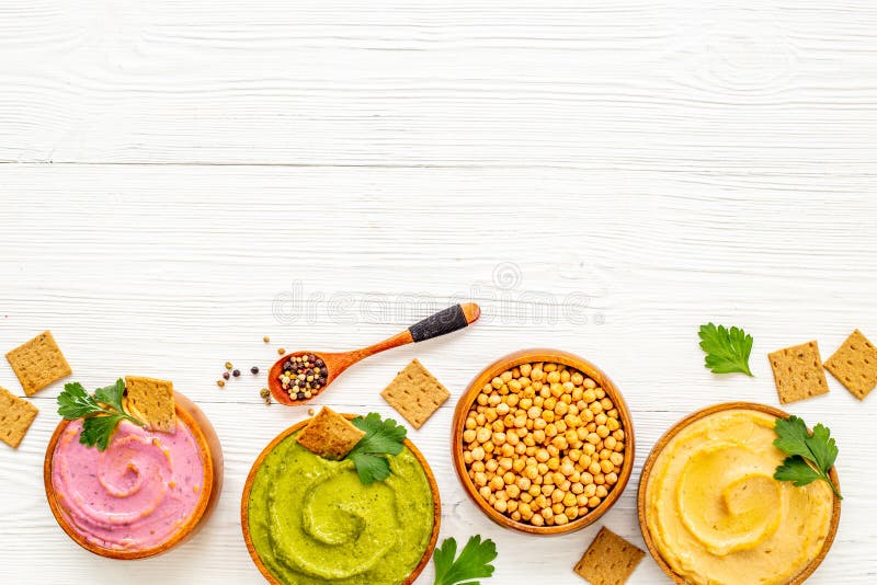 Various Types of Hummus in Bowls. Hummus with Spinach and Beets Stock ...