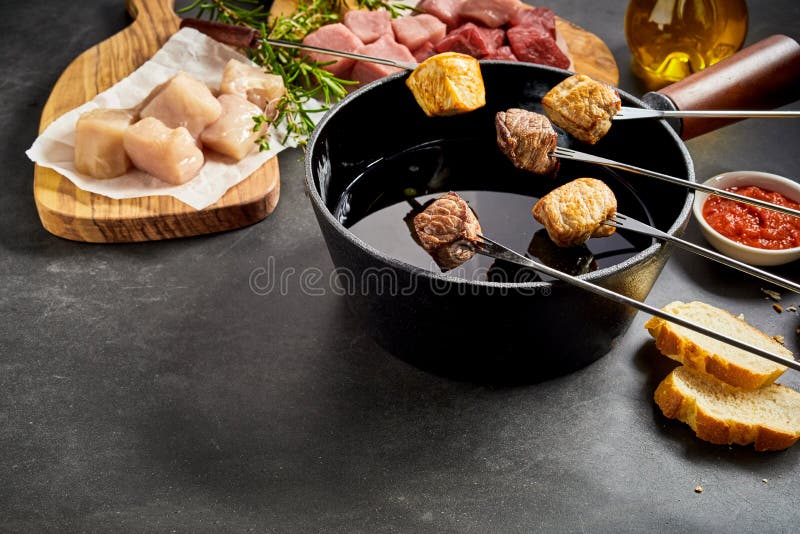 Various Types of Meat and Fondue Setting Stock Photo - Image of bread ...
