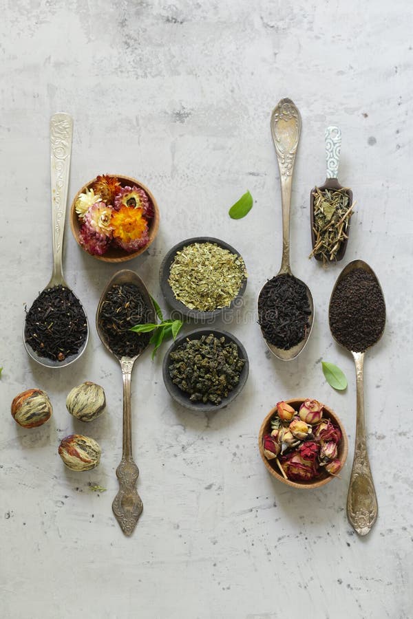 Tea in spoons stock image. Image of drink, flower, black - 146825047