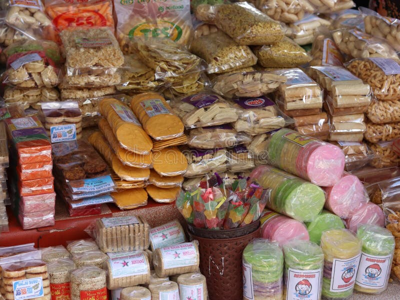 Various Types of Traditional Snacks Wrapped in Plastic are Being Placed ...