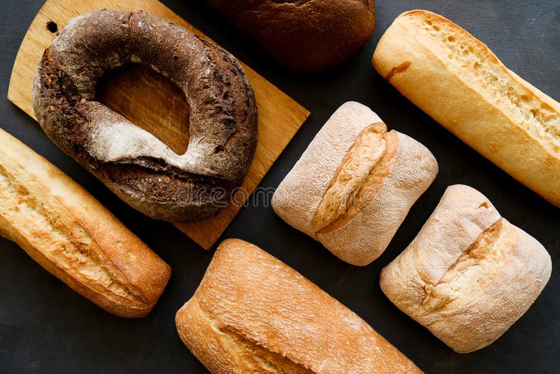 Various Wheat and Rye Baked Bread on Black Background, Knolling Style ...