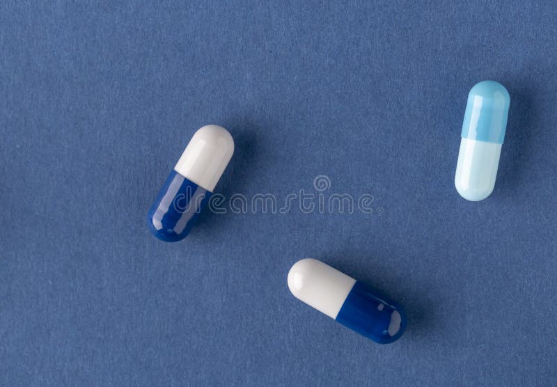 Various White-blue Medication Capsules. Blue Background with Text Space ...