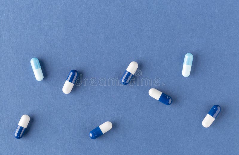 Various White-blue Medication Capsules. Blue Background with Text Space ...