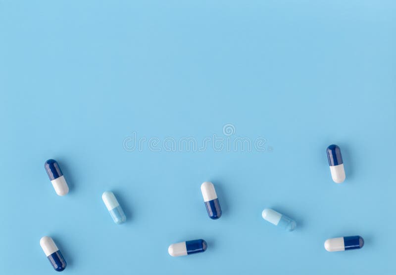 Various White-blue Medication Capsules. Blue Background with Text Space ...