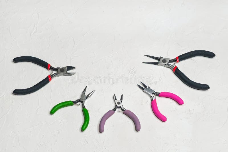 Various Wire Cutters are Laid Out on a White Stock Photo - Image of ...