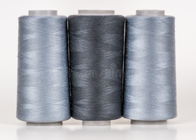 Vary colored thread coils stock image. Image of grey - 103282087