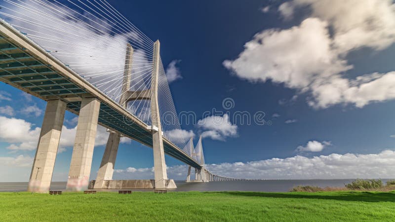Vasco Da Gama Bridge Timelapse Hyperlapse with Green Lawn on a ...