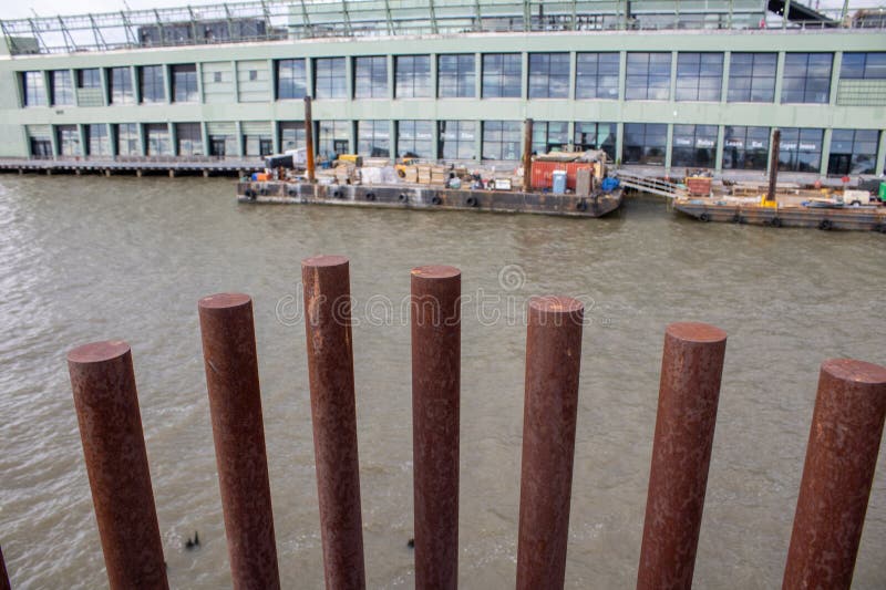 Vast Building by a Bustling Harbor Lined with Numerous Structures ...
