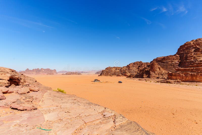 Vast Rocky Desert Landscape with Clear Blue Sky and Sand Formations ...