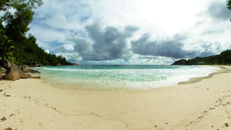 Expansive Tropical Beach with Ocean Waves and Cloudy Sky. Seychelles ...