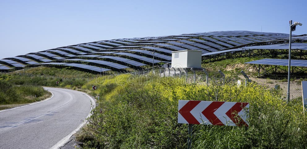 A Vast Solar Panel Array, Consisting of Numerous Rows of Photovoltaic ...