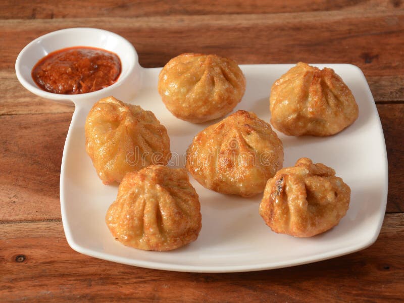 Veg Fried Momo with Sauce Served Over a Rustic Wooden Background ...