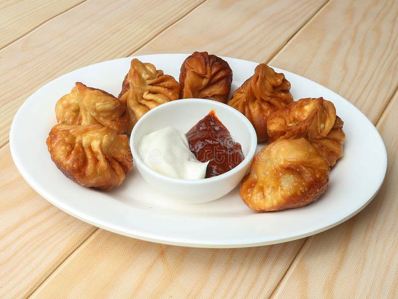 Veg Fried Momo with Sauce Served Over a Rustic Wooden Background ...