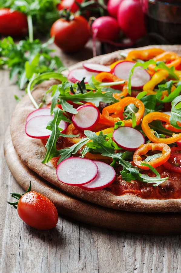 Vegan Pizza with Radish, Tomato and Paprika Stock Image - Image of ...